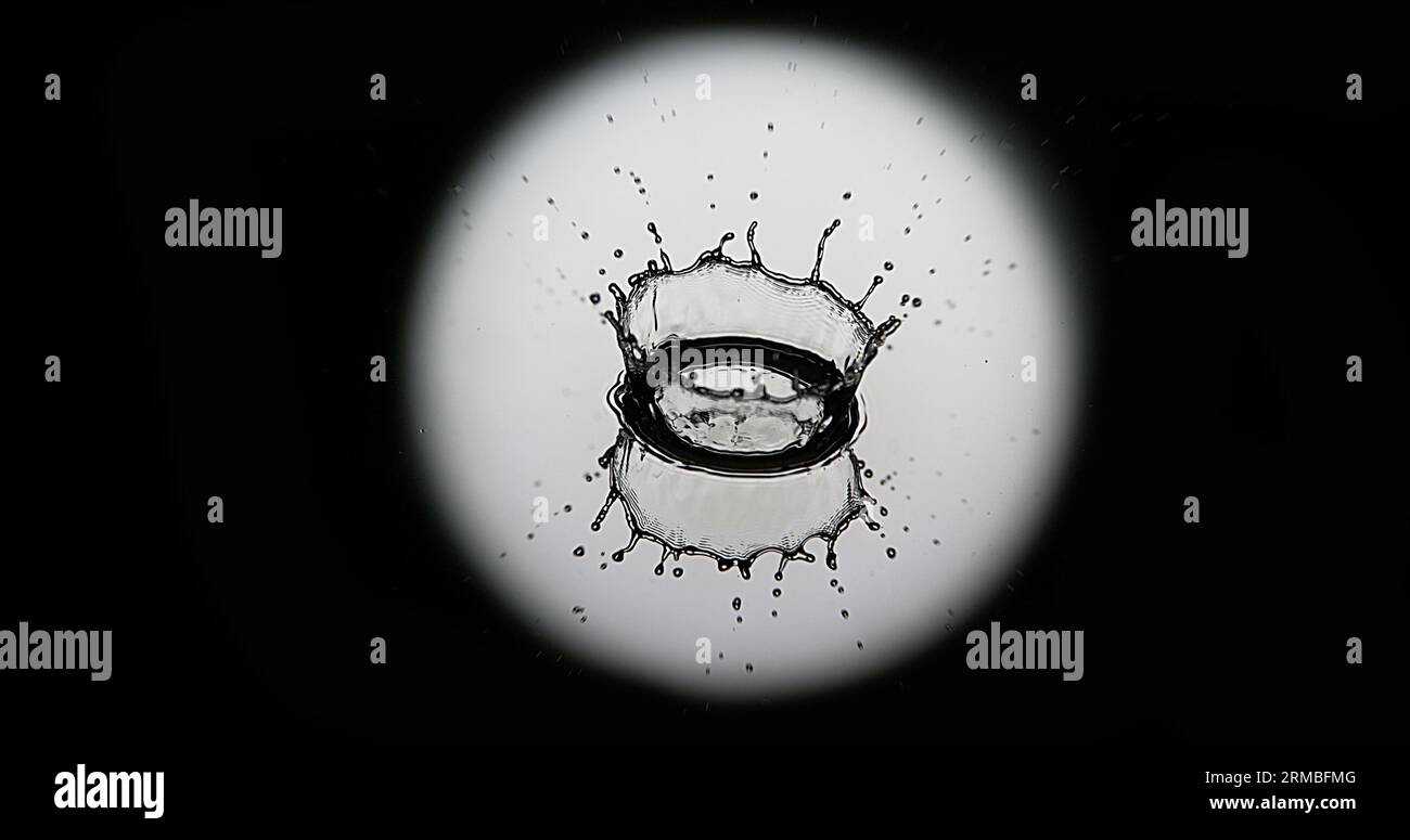 Drop of Water falling into Water, Full Moon Stock Photo - Alamy
