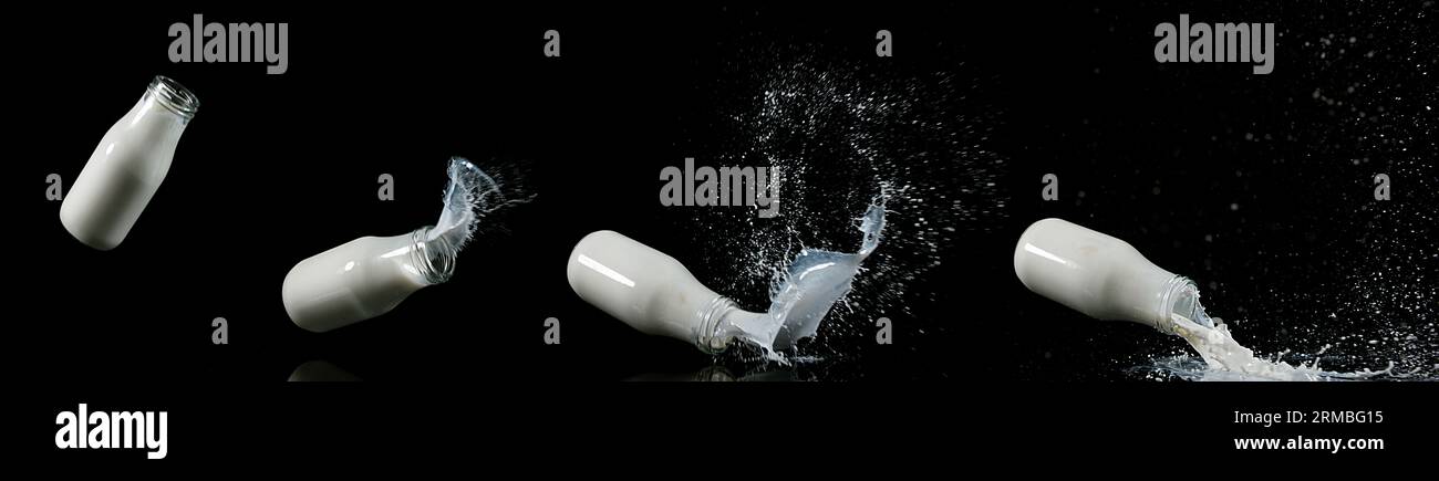 Bottle of Milk Falling and Exploging against Black Background Stock ...