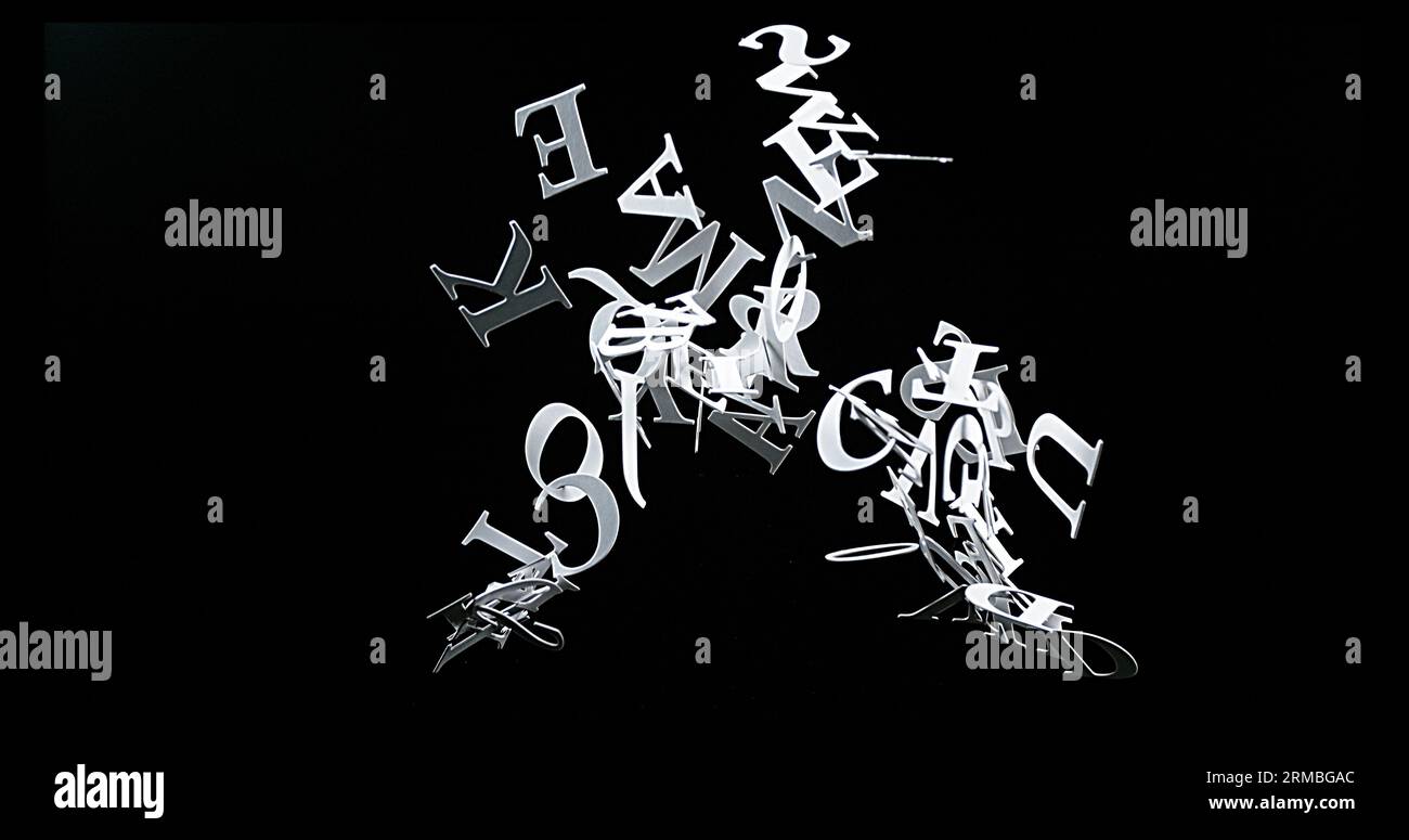 Letters falling against Black Background Stock Photo - Alamy