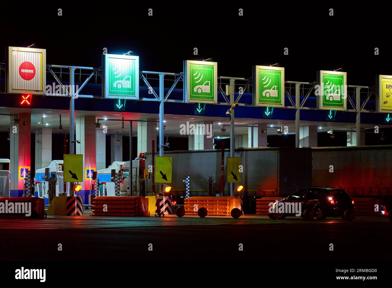 barriers at the entrance to the toll road at night Stock Photo - Alamy