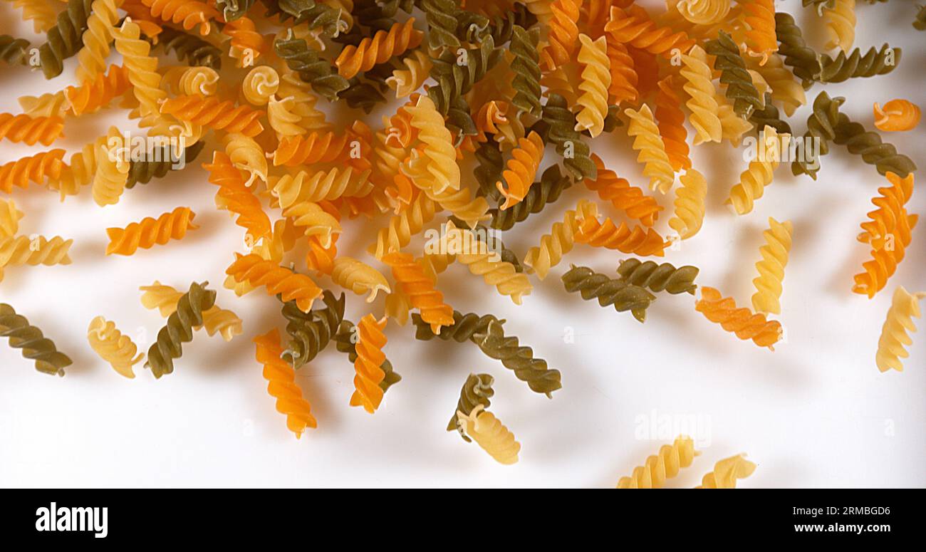 Pasta falling against White Background Stock Photo - Alamy