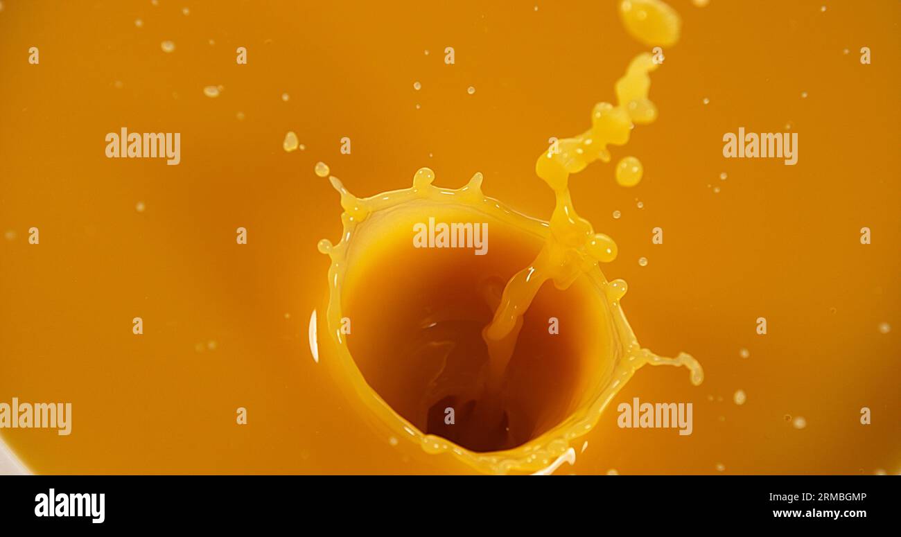 Orange Juice being poured Stock Photo - Alamy
