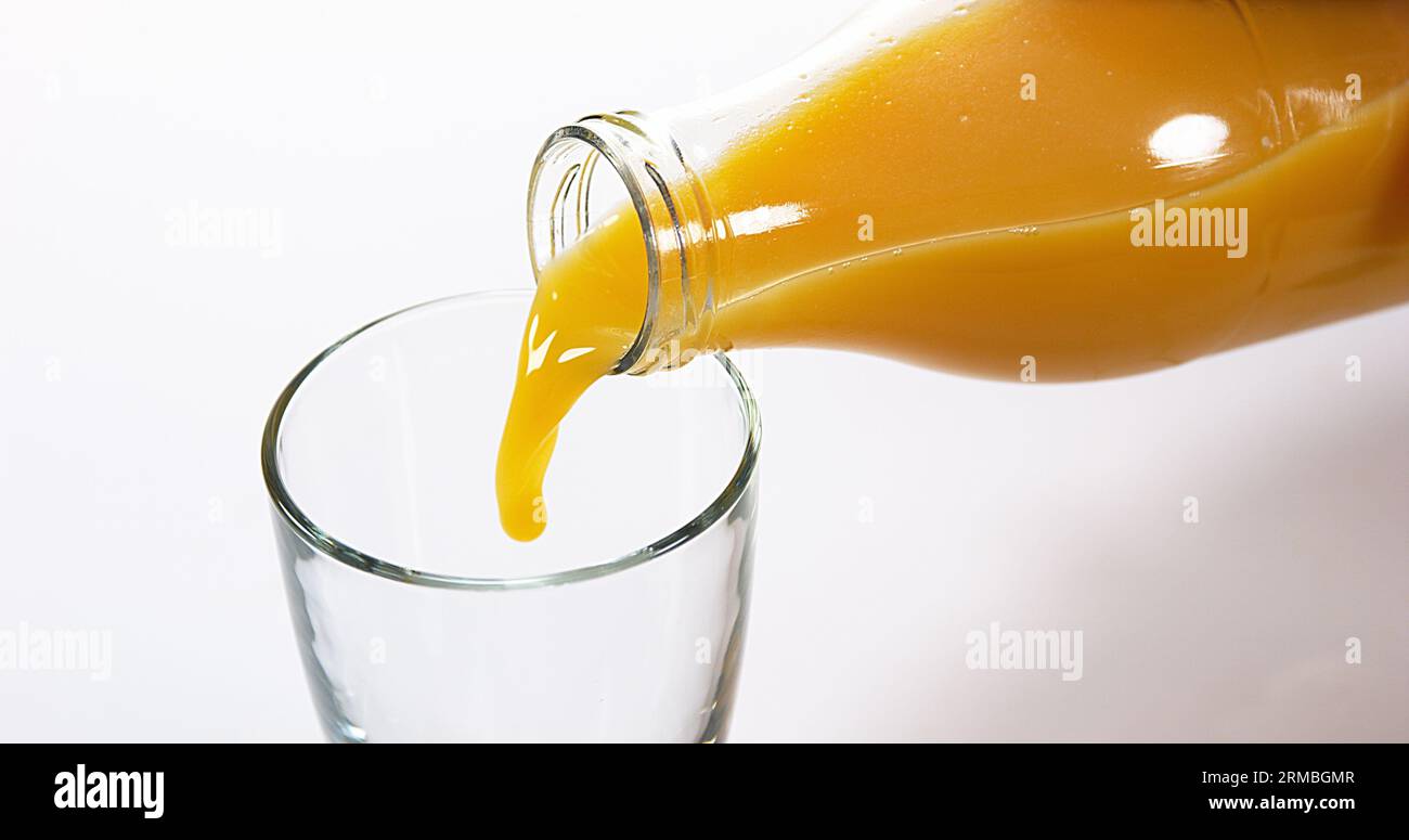 Orange juice poured drinking glass hi-res stock photography and images ...