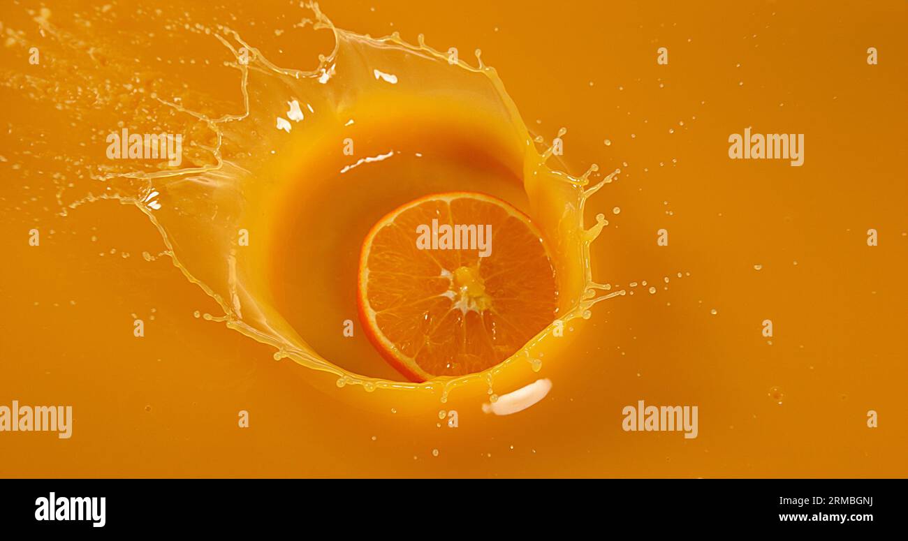 Orange, citrus sinensis, Fruit falling into Orange Juice Stock Photo ...