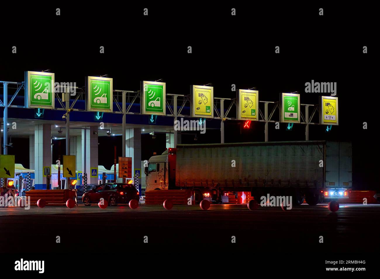 barriers at the entrance to the toll road at night Stock Photo - Alamy