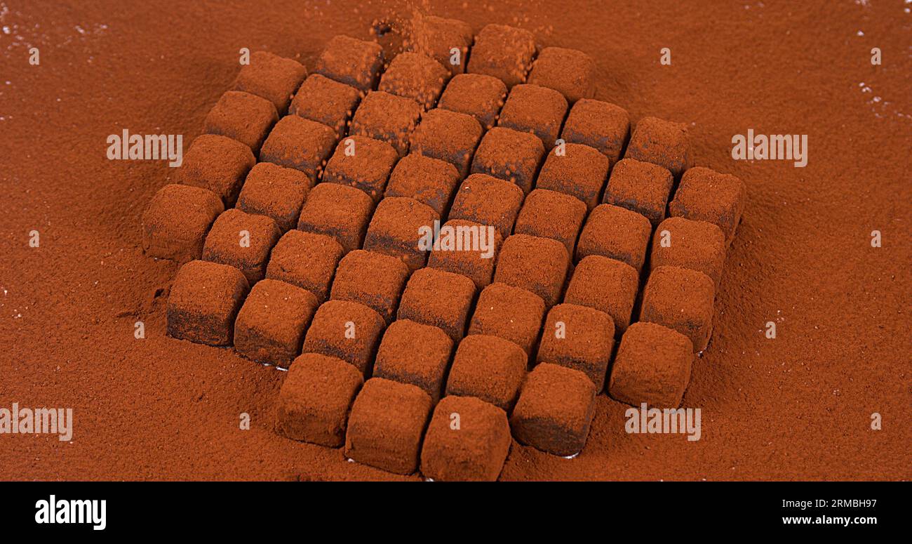 Chocolate Powder falling on Chocolate Truffles Stock Photo - Alamy