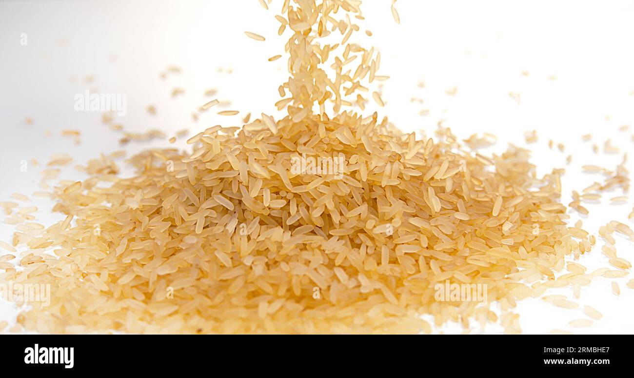 Rice falling against White Background Stock Photo - Alamy