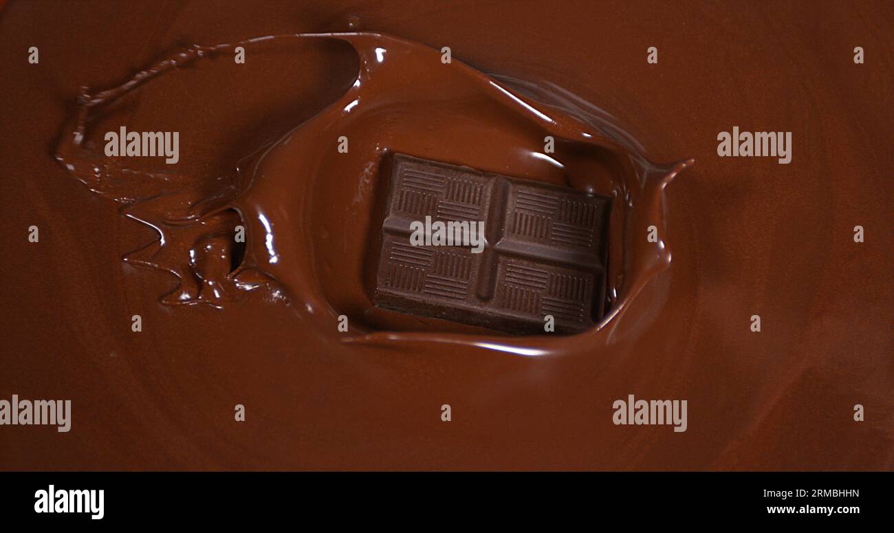 Black Chocolate tablet falling into Milk Chocolate Stock Photo - Alamy