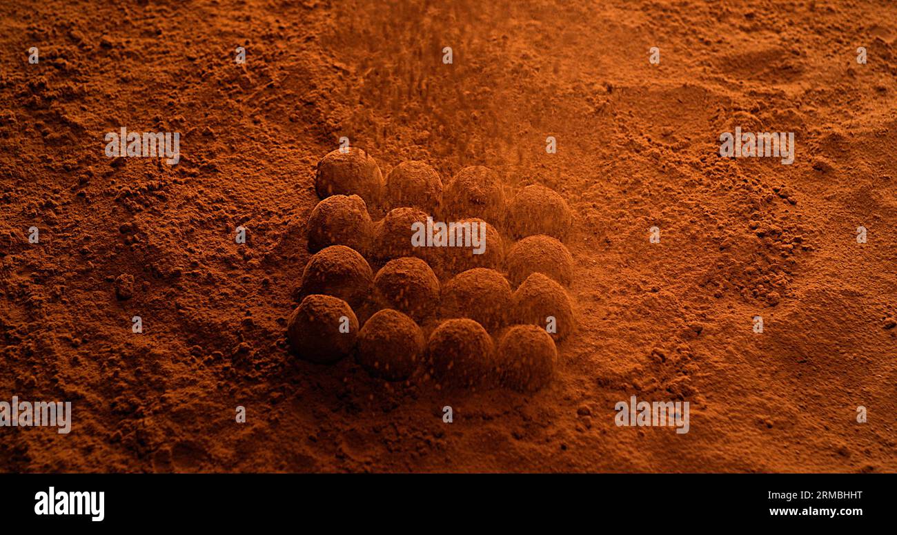 Chocolate Powder falling on Chocolate Truffles Stock Photo - Alamy