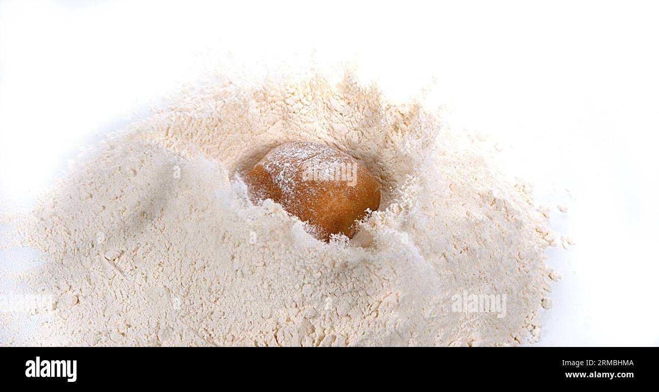 Bread Falling in Flour against White Background Stock Photo - Alamy