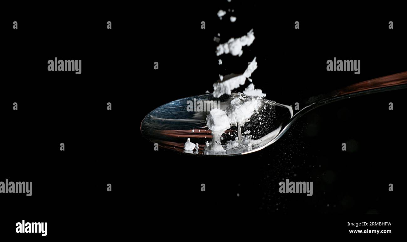Drug, Cocaine in spoon against black background Stock Photo - Alamy