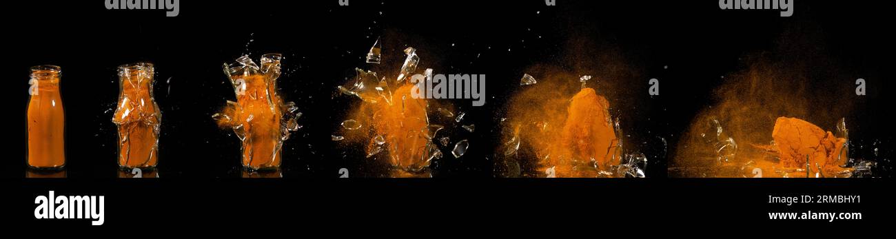 Turmeric, curcuma longa, Powder in a small Jar Exploding against Black ...