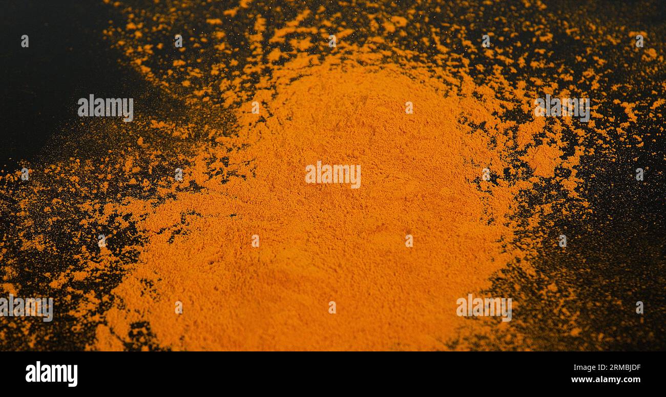 Turmeric, curcuma longa, Powder falling against Black Background ...