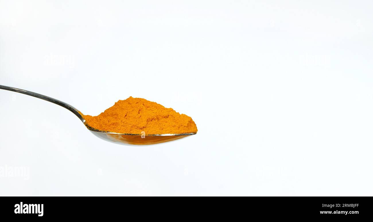 Turmeric, curcuma longa, curcuma Powder falling on Spoon, Indian Spice ...