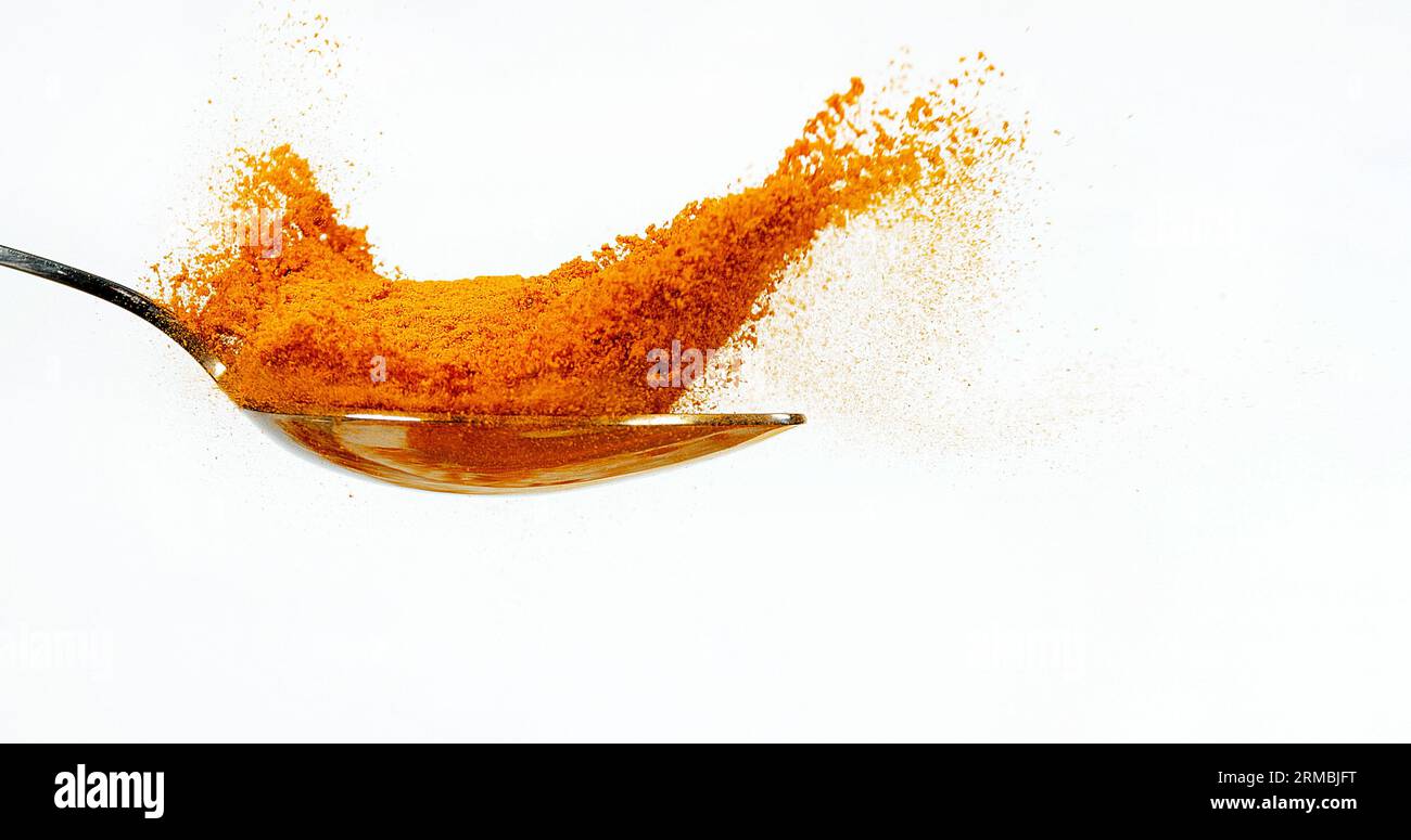 Turmeric, curcuma longa, curcuma Powder falling on Spoon, Indian Spice ...