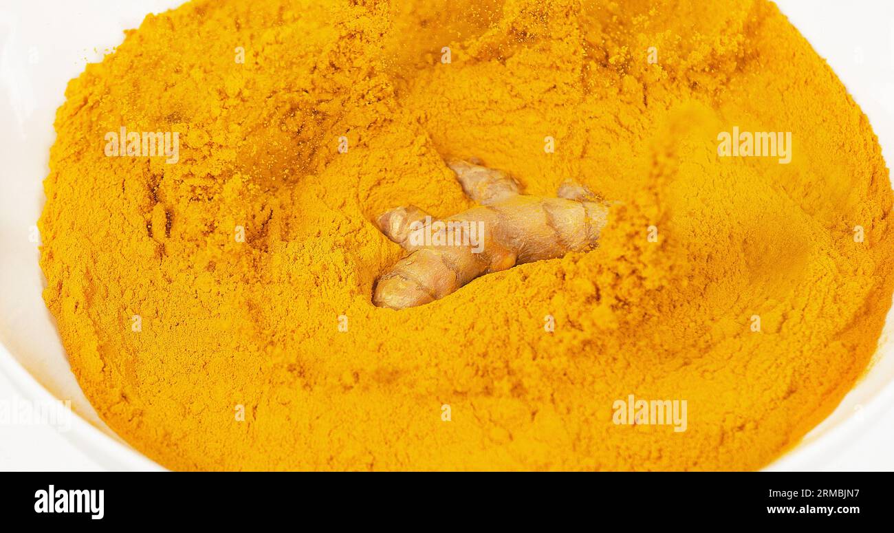 Turmeric, curcuma longa, Root falling on curcuma Powder, Indian Spice ...
