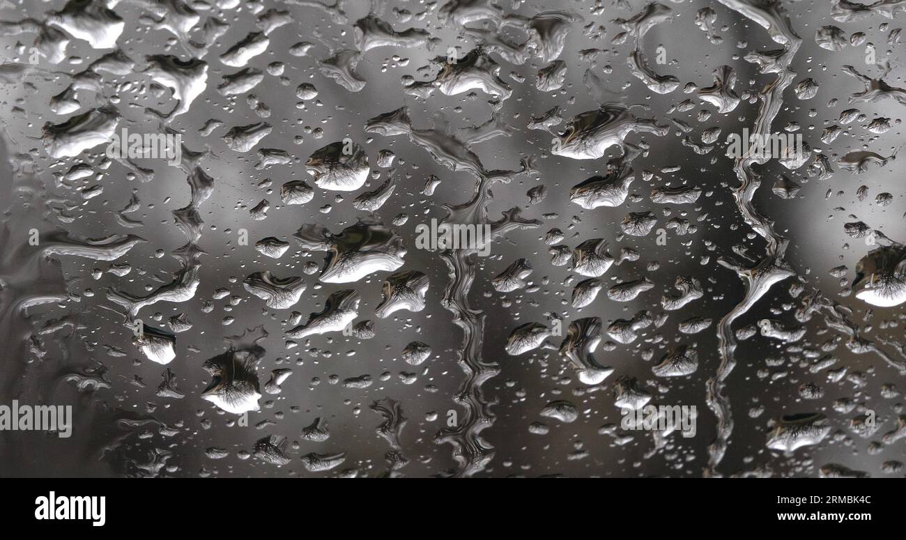 Rain dripping on the windshield of the car Stock Photo - Alamy
