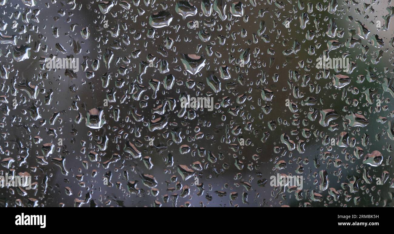 Rain dripping on the windshield of the car Stock Photo - Alamy