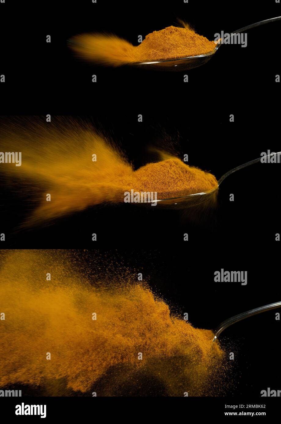 Spoon and Curry Powder falling from Spoon against Black Background ...