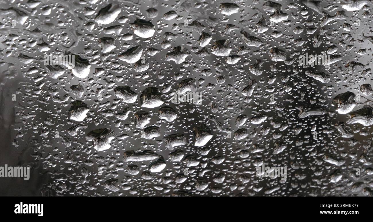 Rain dripping on the windshield of the car Stock Photo - Alamy