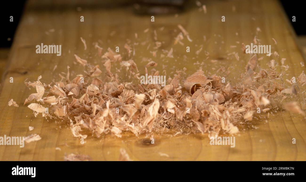 Wood chips falling on board hi-res stock photography and images - Alamy