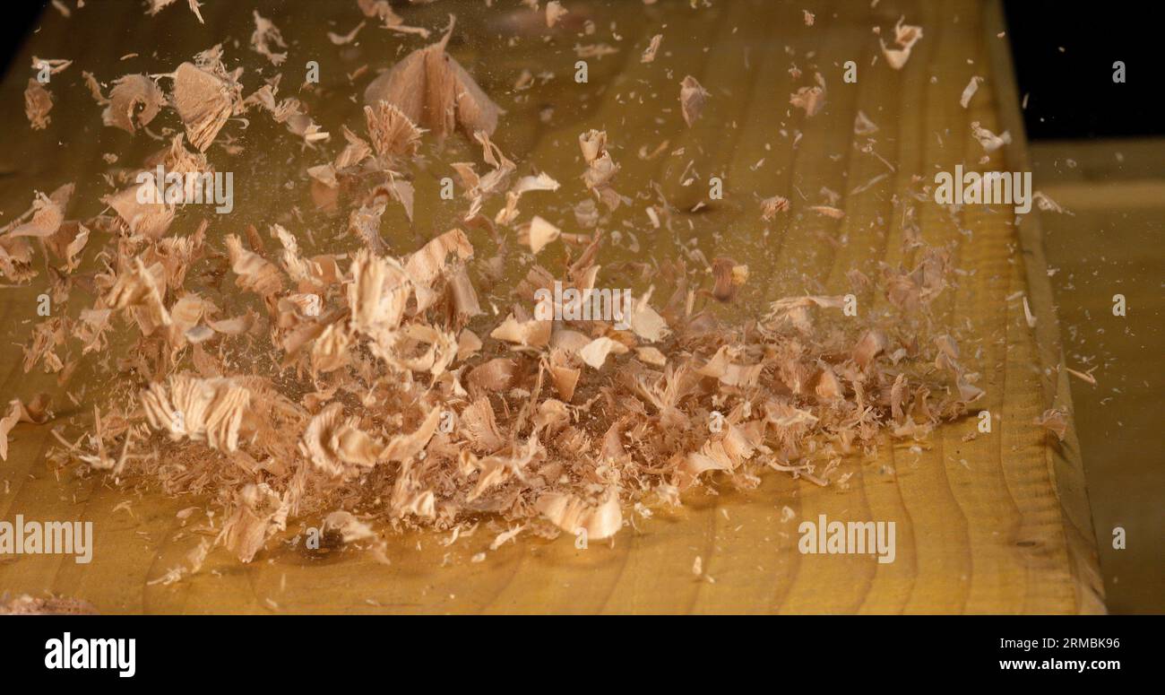Wood Chips Falling on a Board Stock Photo - Alamy