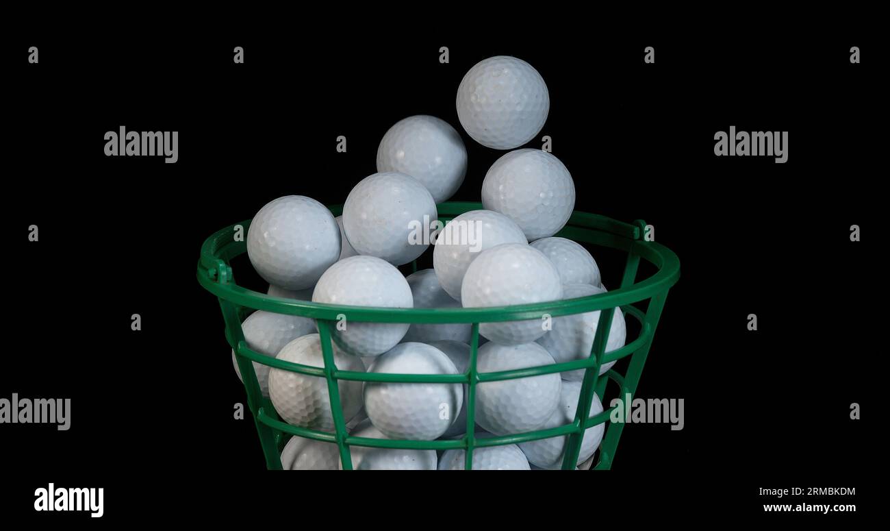 Golf's Balls falling against Black background Stock Photo - Alamy