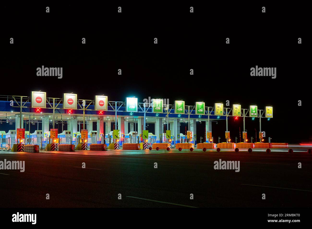 barriers at the entrance to the toll road at night Stock Photo - Alamy