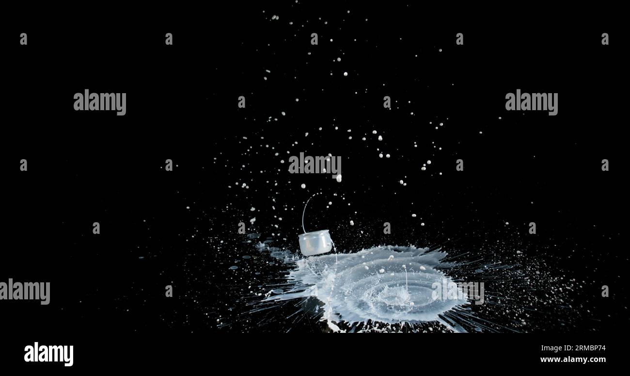 Glass of Milk Bouncing and Splashing on Black Background Stock Photo ...