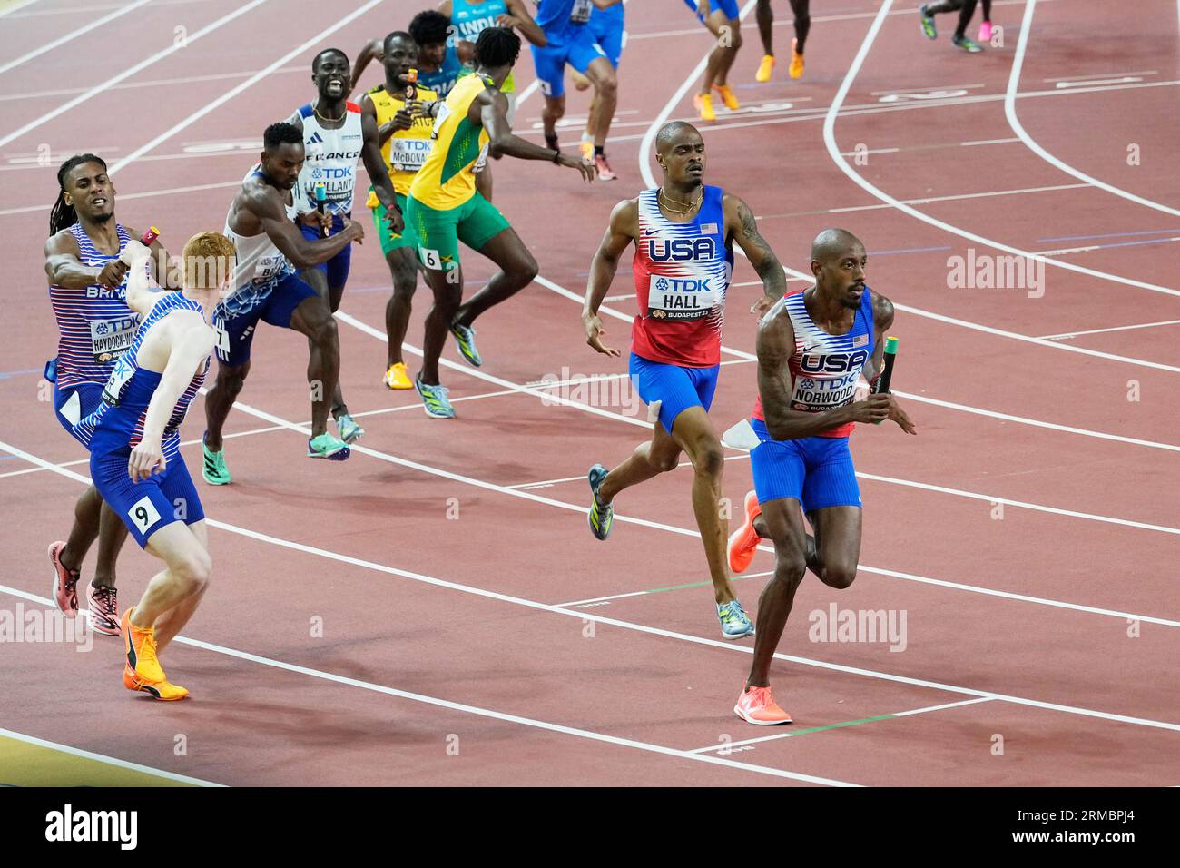 Winners of the United States' team, right, compete in the Men's 4x400 ...