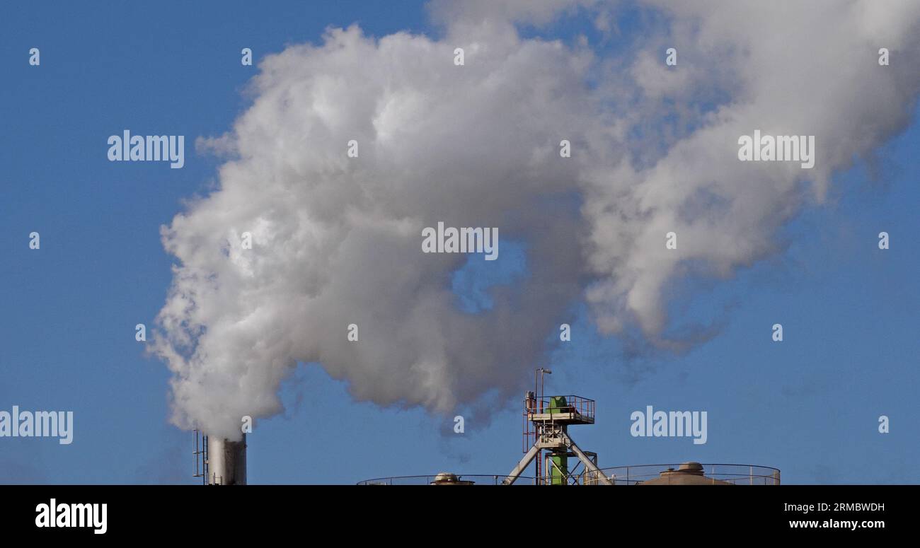 Smokestack of Sugar Refinery with Water Vapour, Near Caen in Normandy ...