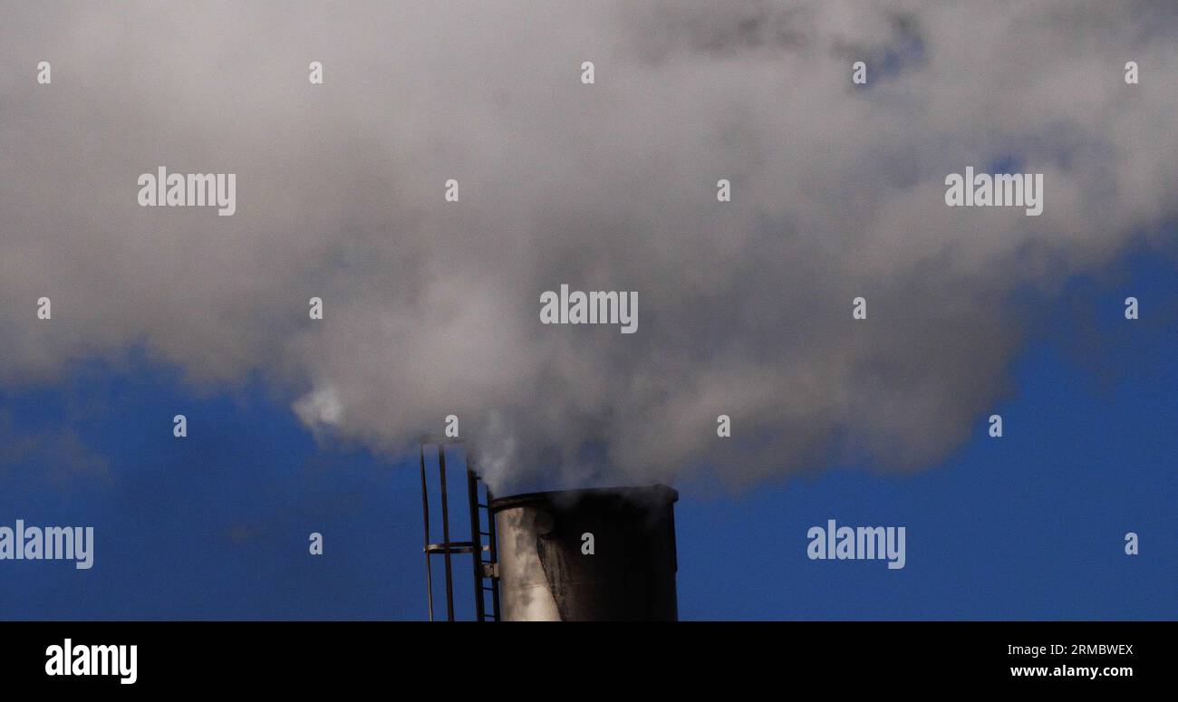 Smokestack of Sugar Refinery with Water Vapour, Near Caen in Normandy ...