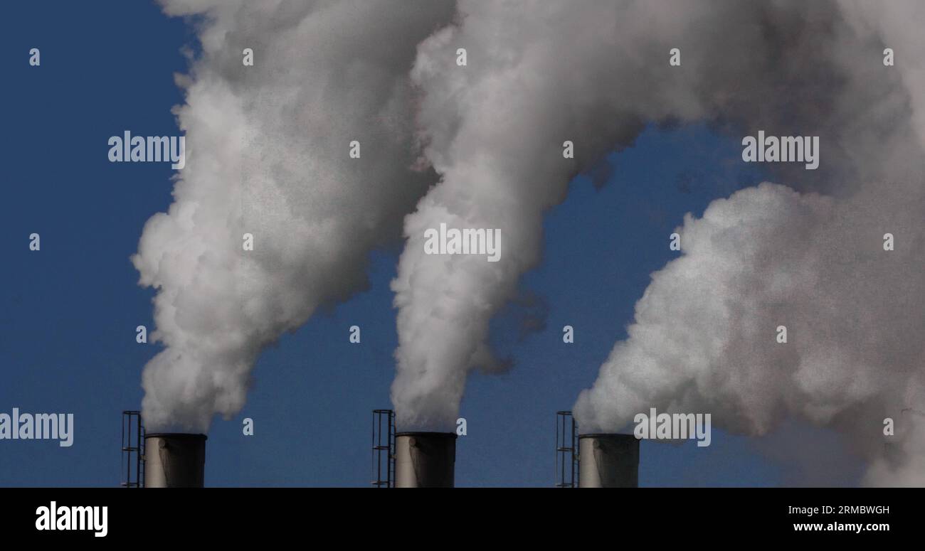 Smokestack of Sugar Refinery with Water Vapour, Near Caen in Normandy ...