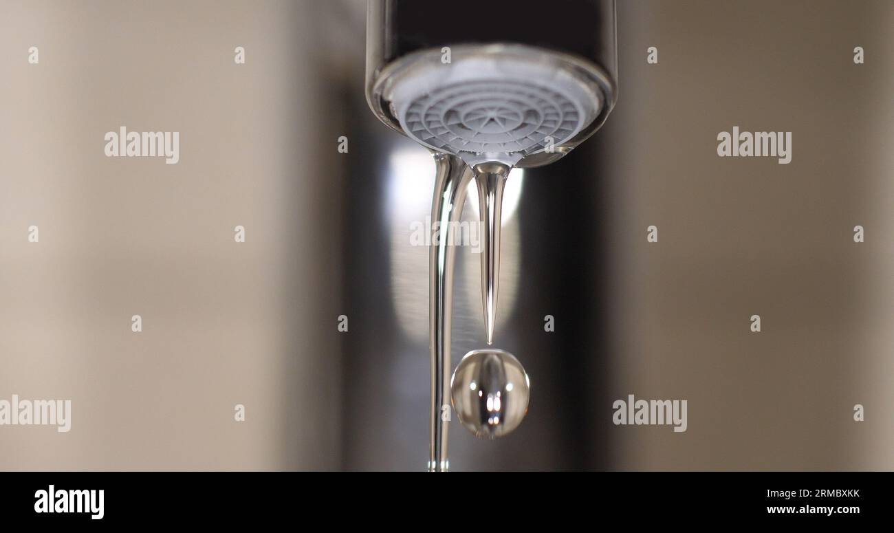 Water droplet falling from tap hi-res stock photography and images - Alamy