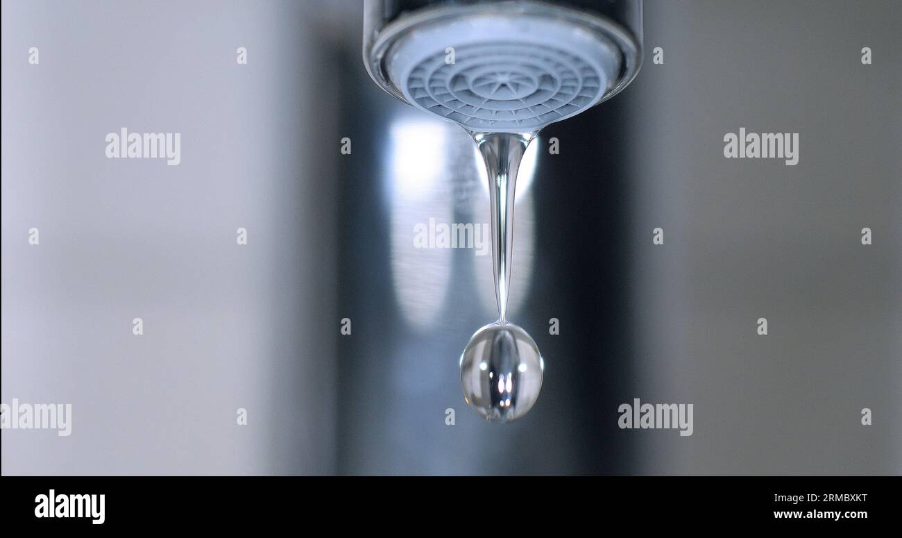 Water droplet falling from tap hi-res stock photography and images - Alamy