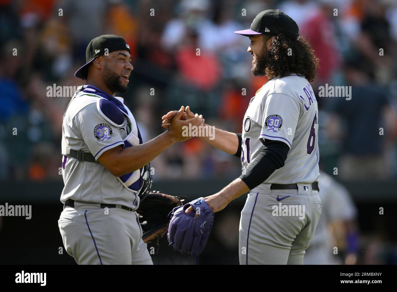 Colorado Rockies relief pitcher Justin Lawrence, right, and catcher ...
