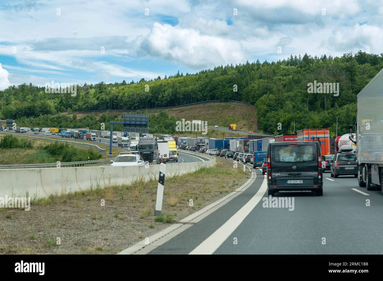 Germany- August 01, 2023: Traffic on Motorway A3 and lorries waiting in ...