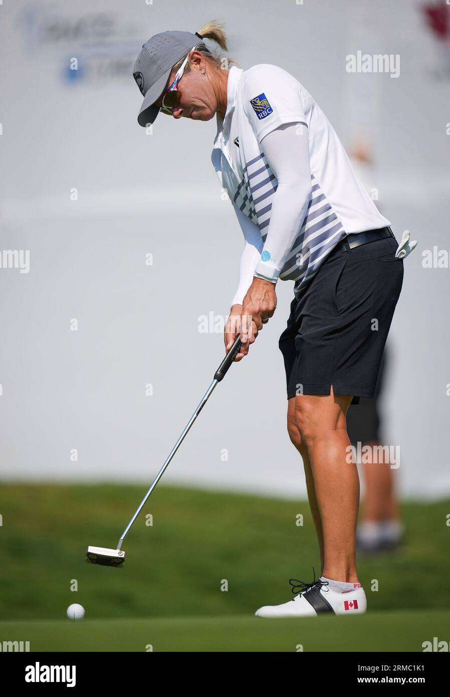 Alena Sharp, of Canada, putts on the 18th hole during the final round ...