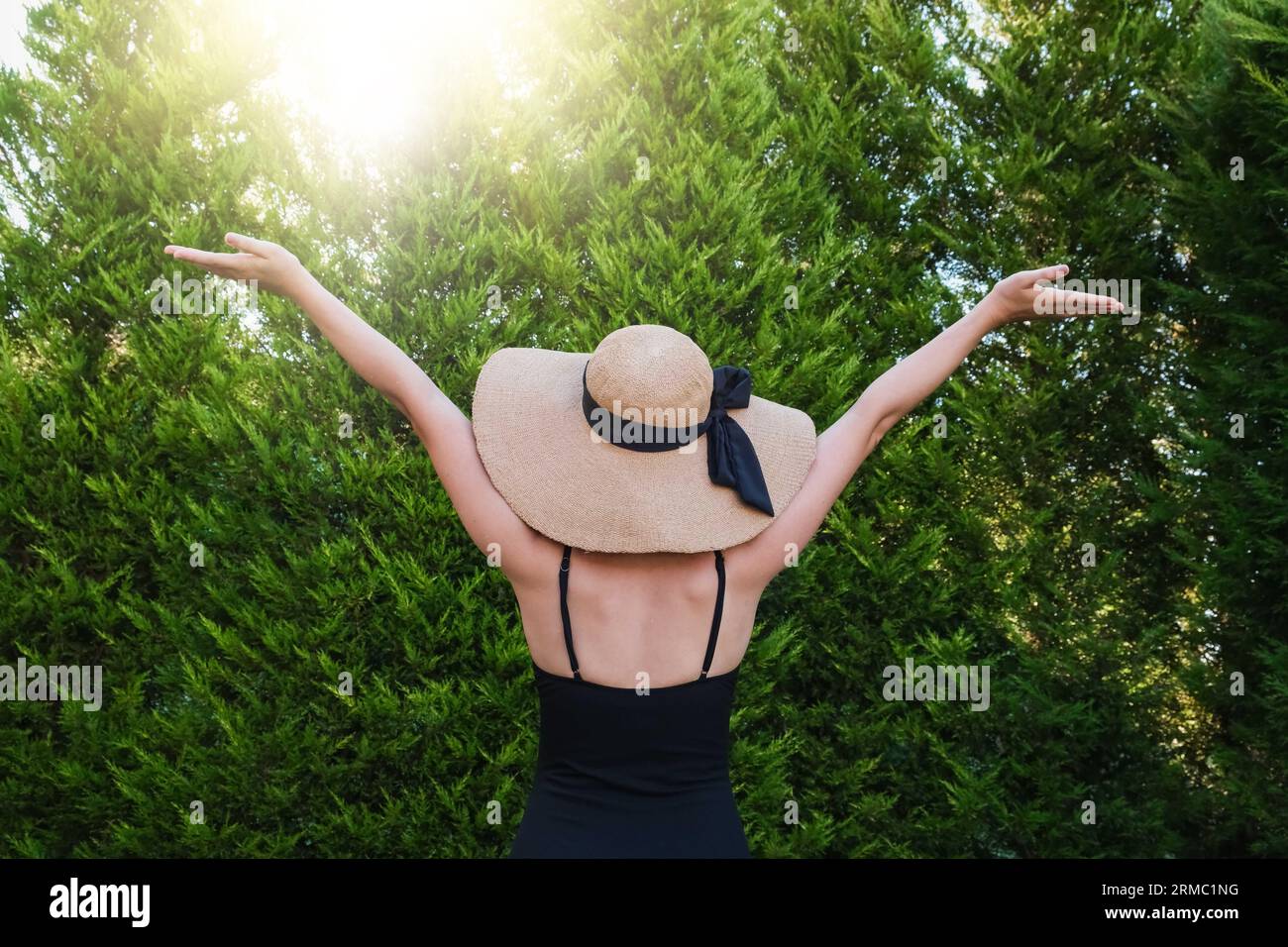 Overjoyed and excited young lady opening arms outstretched in front of ...