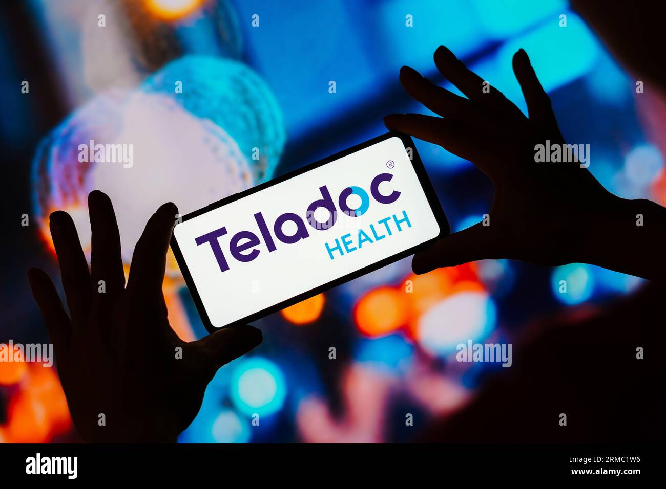In this photo illustration, the Teladoc Health logo seen displayed on a ...