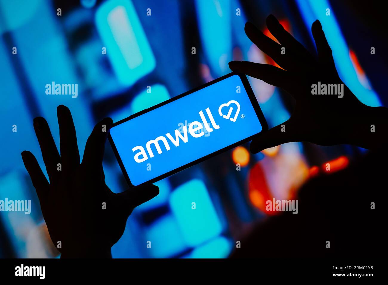 In this photo illustration, the Amwell logo seen displayed on a ...