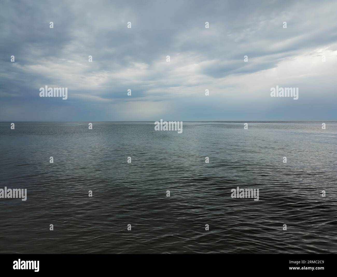 dark sea and sky - calm sea, cloudy sky - sea view, horizontal wallpaper Stock Photo - Alamy