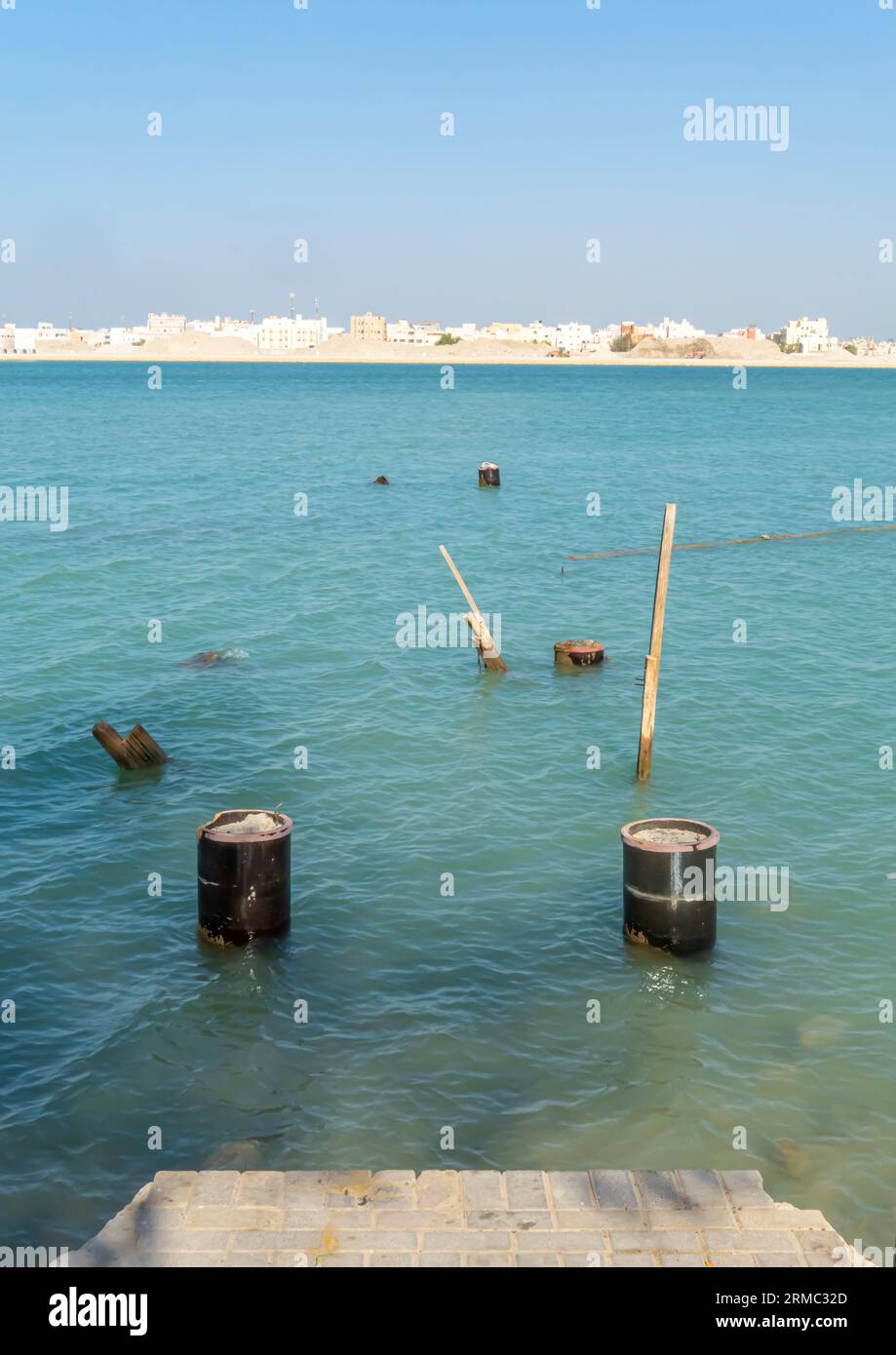 Mooring buoys wooden blocks in water Muharraq Bahrain Stock Photo - Alamy