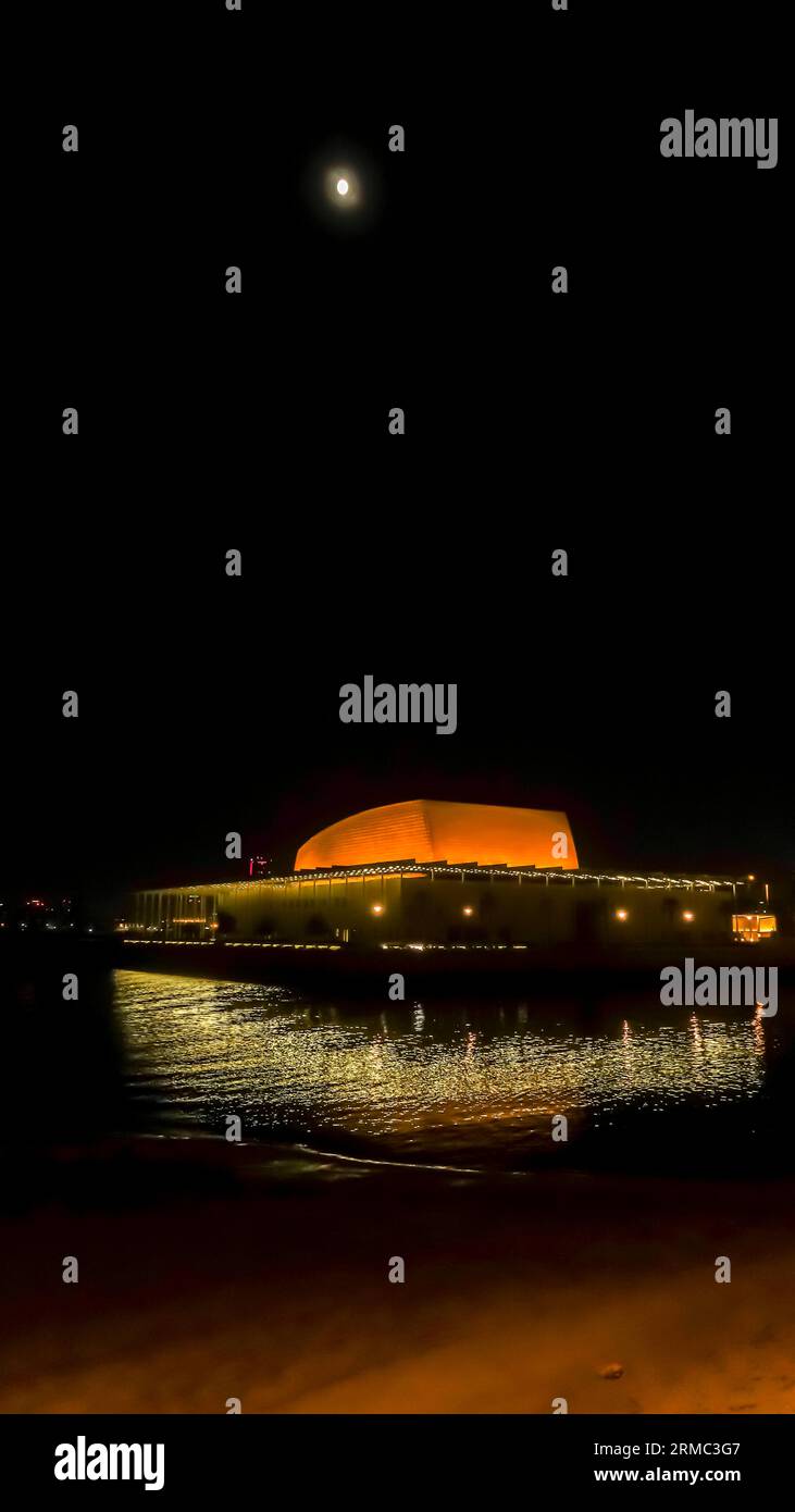 Bahrain National Museum building exterior at night Stock Photo - Alamy