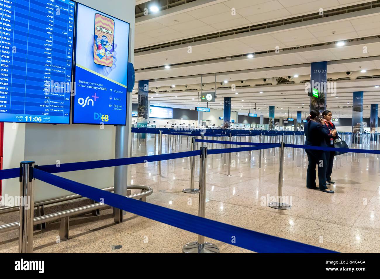 Dubai airport arrivals area - passport control zone, two female cabin ...
