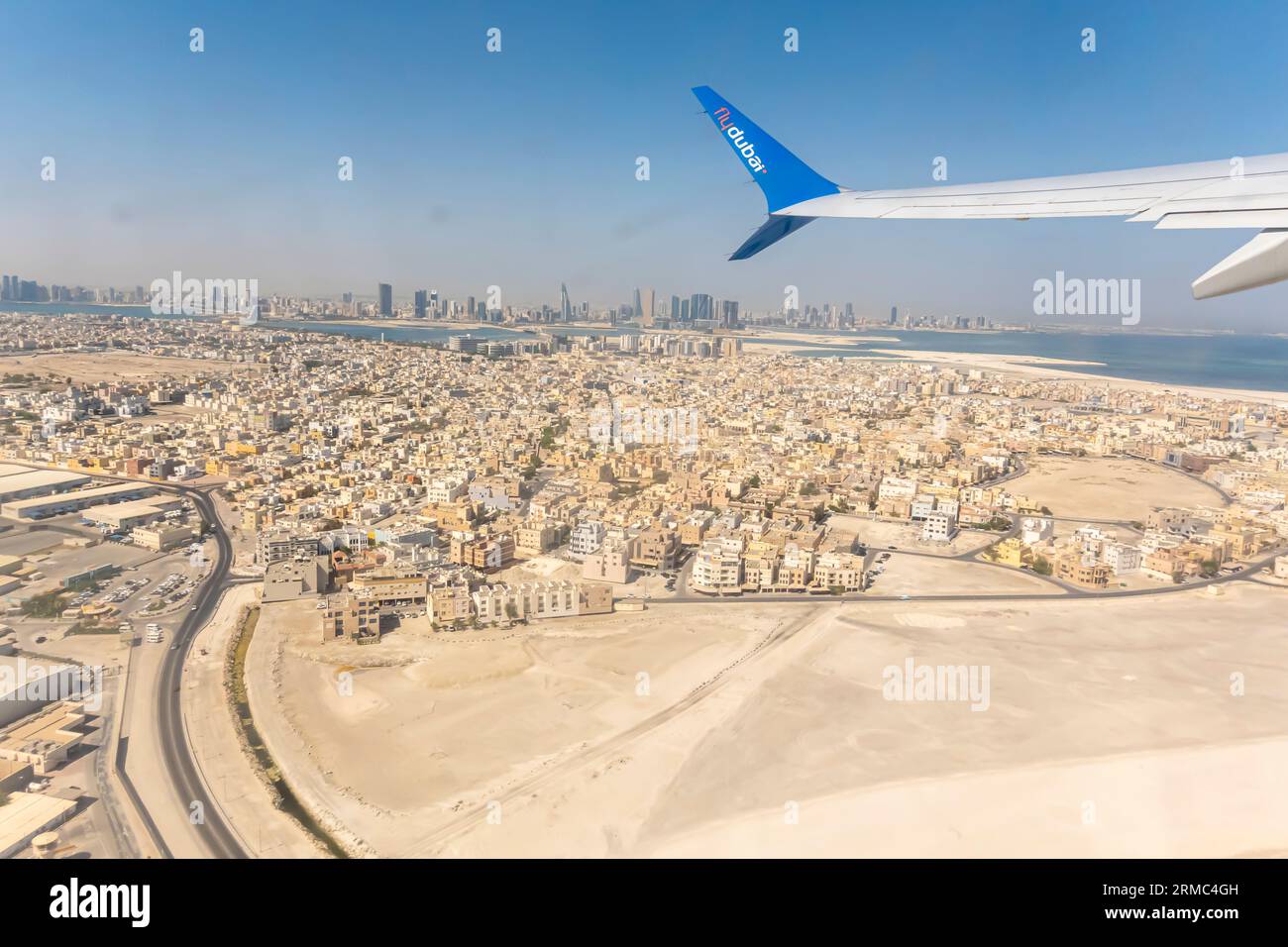 Bahrain from airplane with FlyDubai wing - view out of airplane window ...