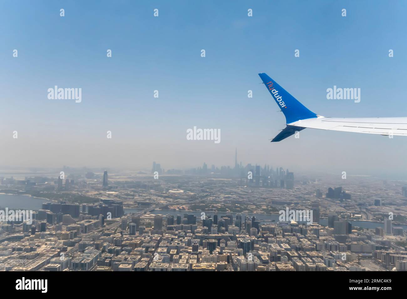 Dubai UAE from airplane with FlyDubai wing - view out of airplane ...