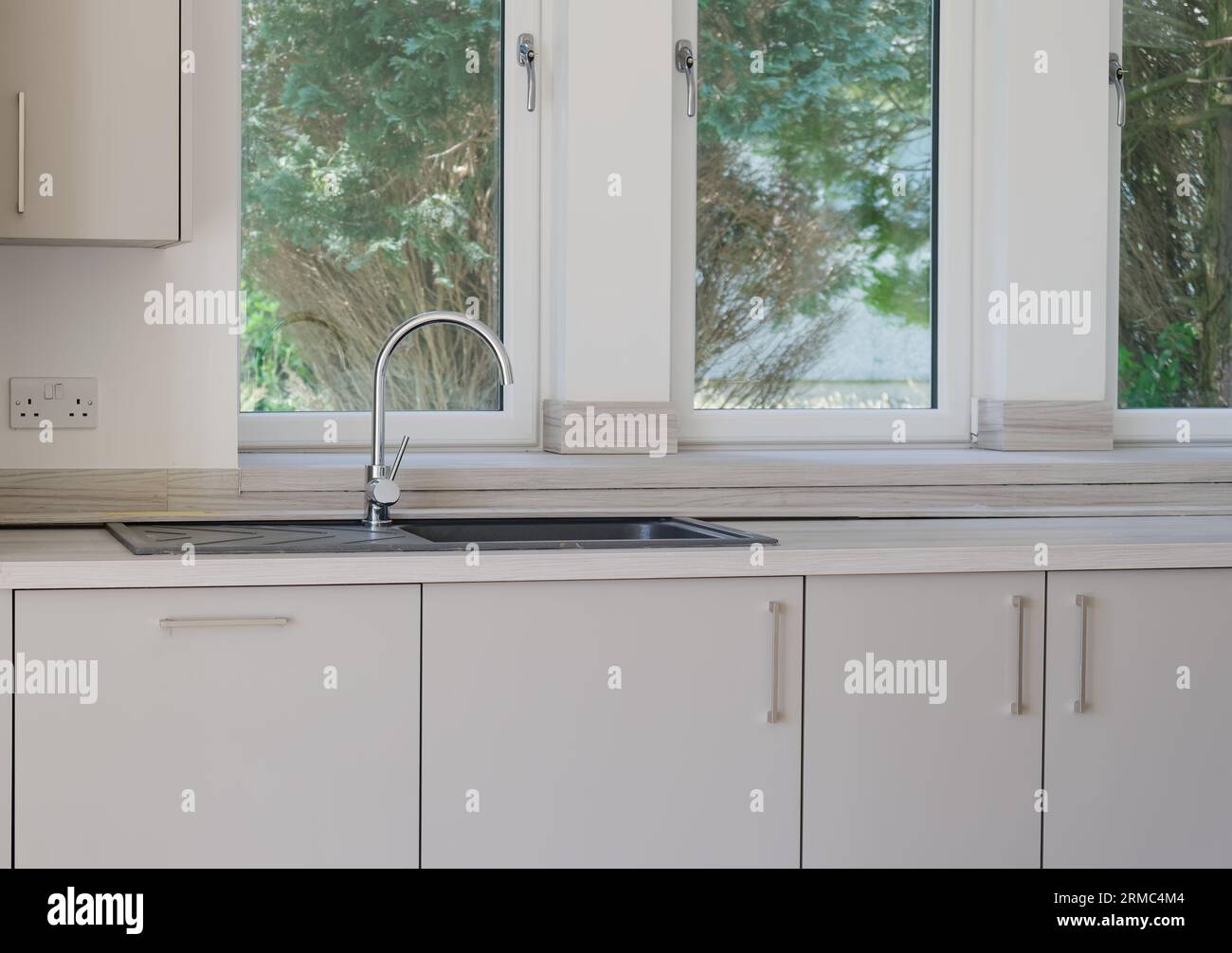 New kitchen sink and worktop installation using neutral colour Stock ...