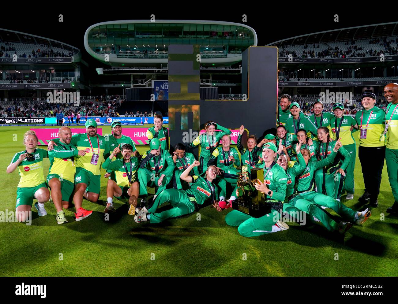 Southern Brave women celebrate with their trophy on the pitch following ...