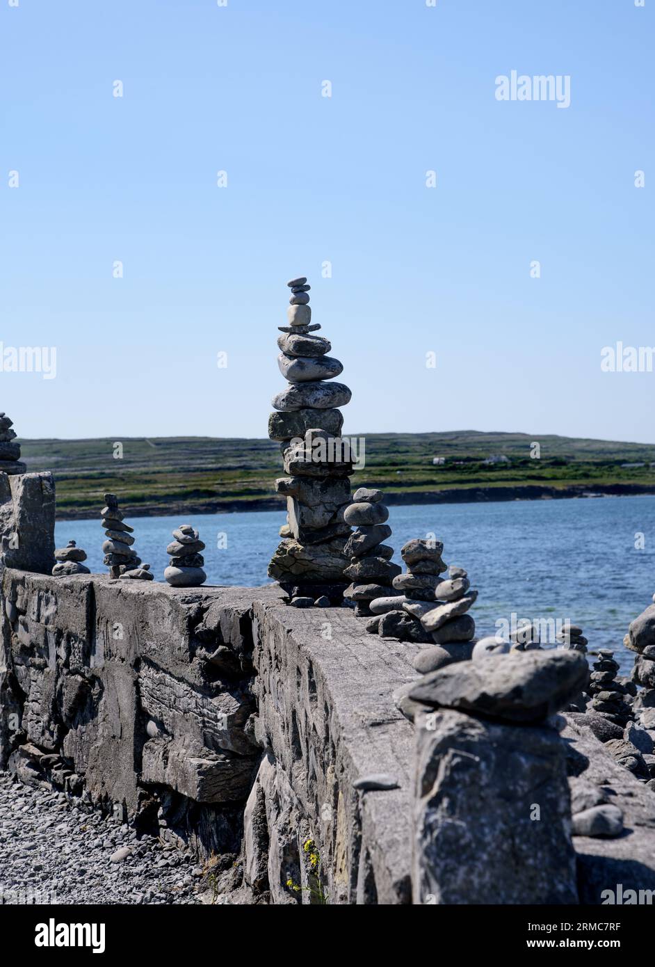 The coast road near seal colony with stone cairns pyramids on the Inis ...